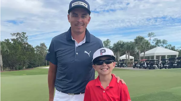 Rickie Fowler invites young fan inside the ropes at Grant Thornton ...