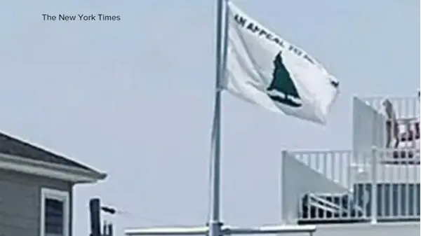 2nd flag carried by Jan. 6 rioters displayed outside house Justice ...